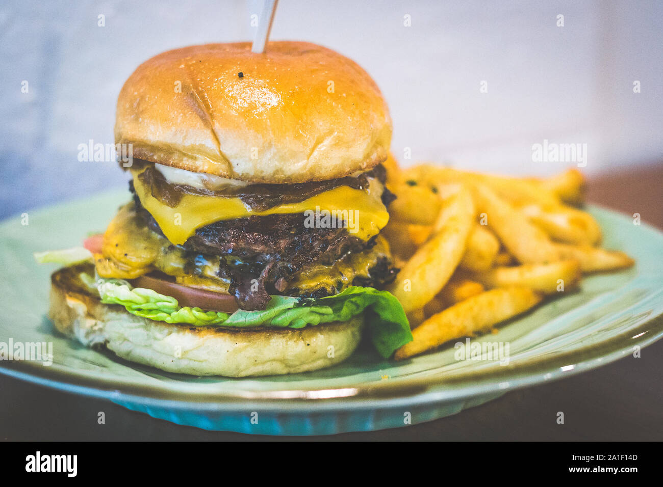 Classic Burger In Brioche Bun With Fries Grilled beef patty (120gm ...