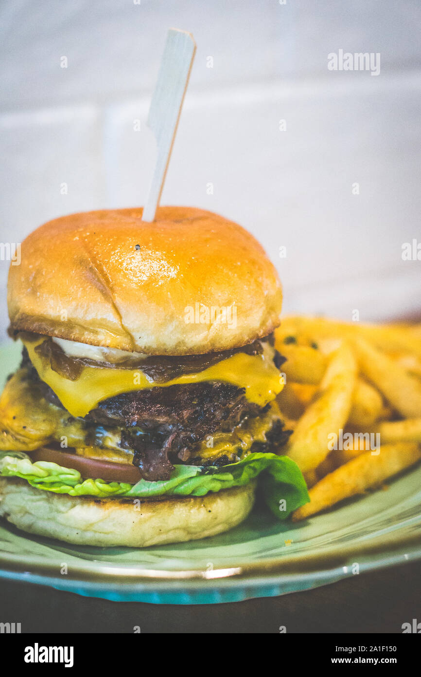 Classic Burger In Brioche Bun With Fries Grilled beef patty (120gm ...