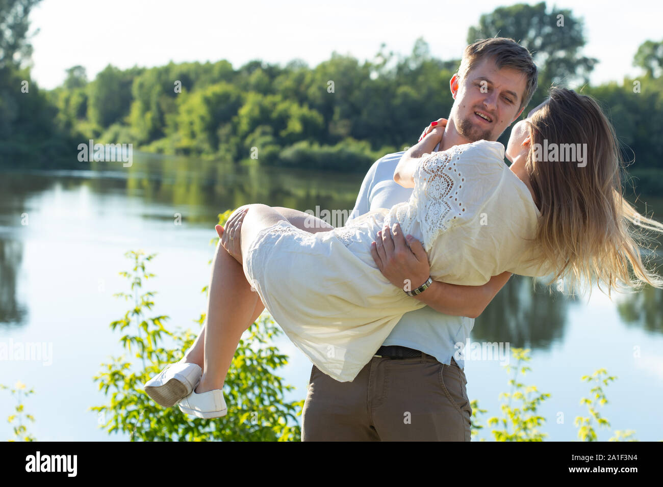 happy romantic couple in love and having fun outdoor in summer day ...