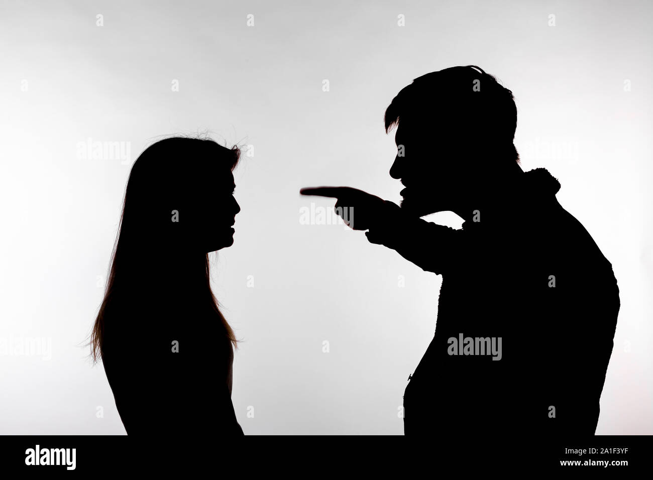 Aggression and abuse concept - man and woman expressing domestic ...