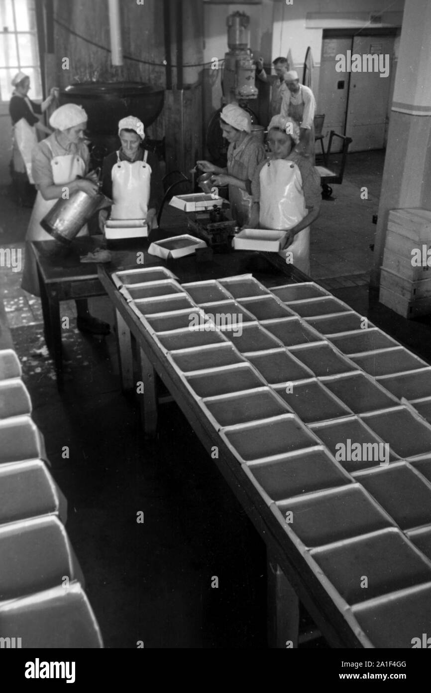 Factory conveyor sweets Black and White Stock Photos & Images - Alamy