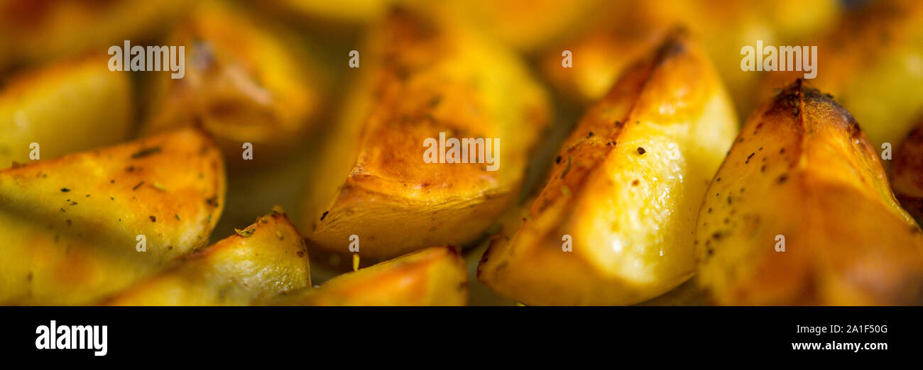 ready baked potato slices after oven close up Stock Photo - Alamy