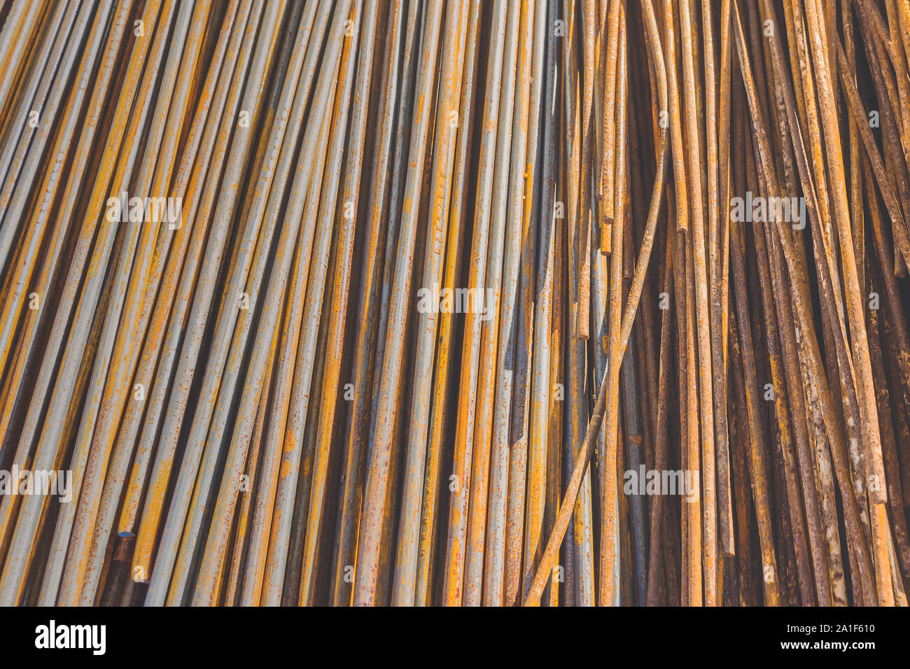 Background texture of old rusty steel bars construction materials in a ...