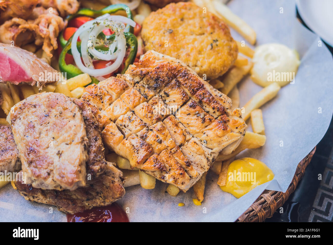 Big set Greek food Meat plate with potatoes and sauce Stock Photo - Alamy