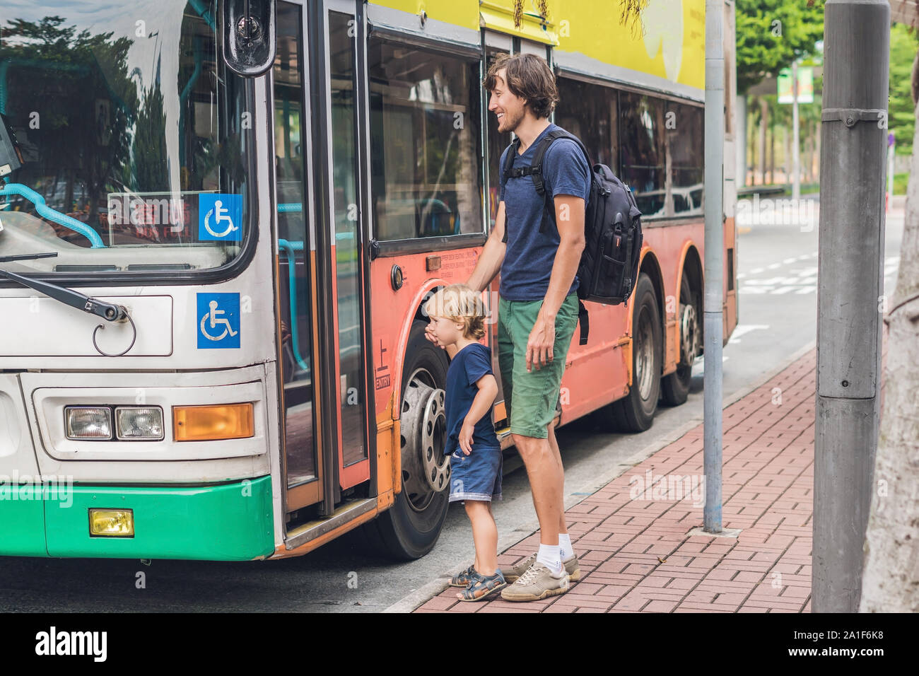 Father and son going to go by bus in Hong Kong Stock Photo - Alamy