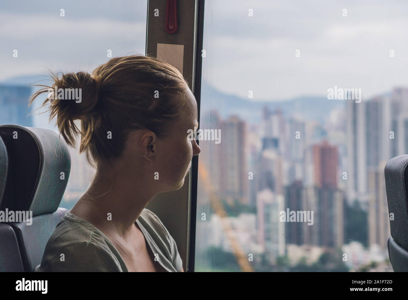 beautiful young woman taking bus to work Stock Photo - Alamy