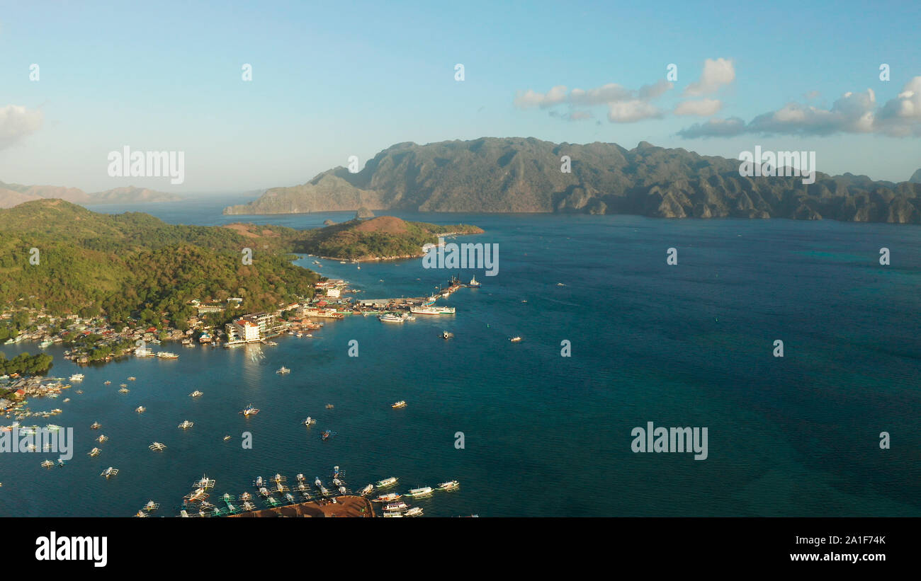 Aerial view Coron city with slums and poor district. sea port, pier ...