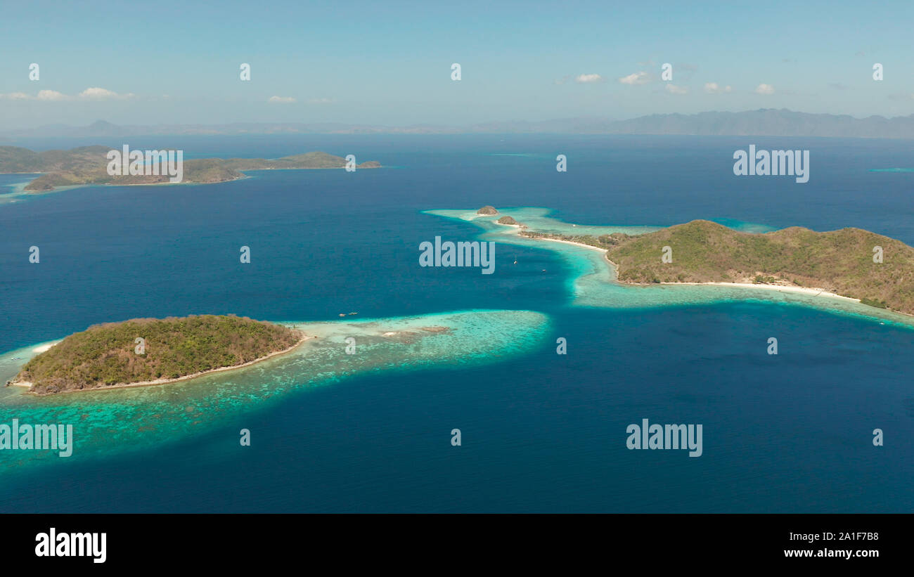 aerial drone tropical islands with blue lagoons, coral reef and sandy ...