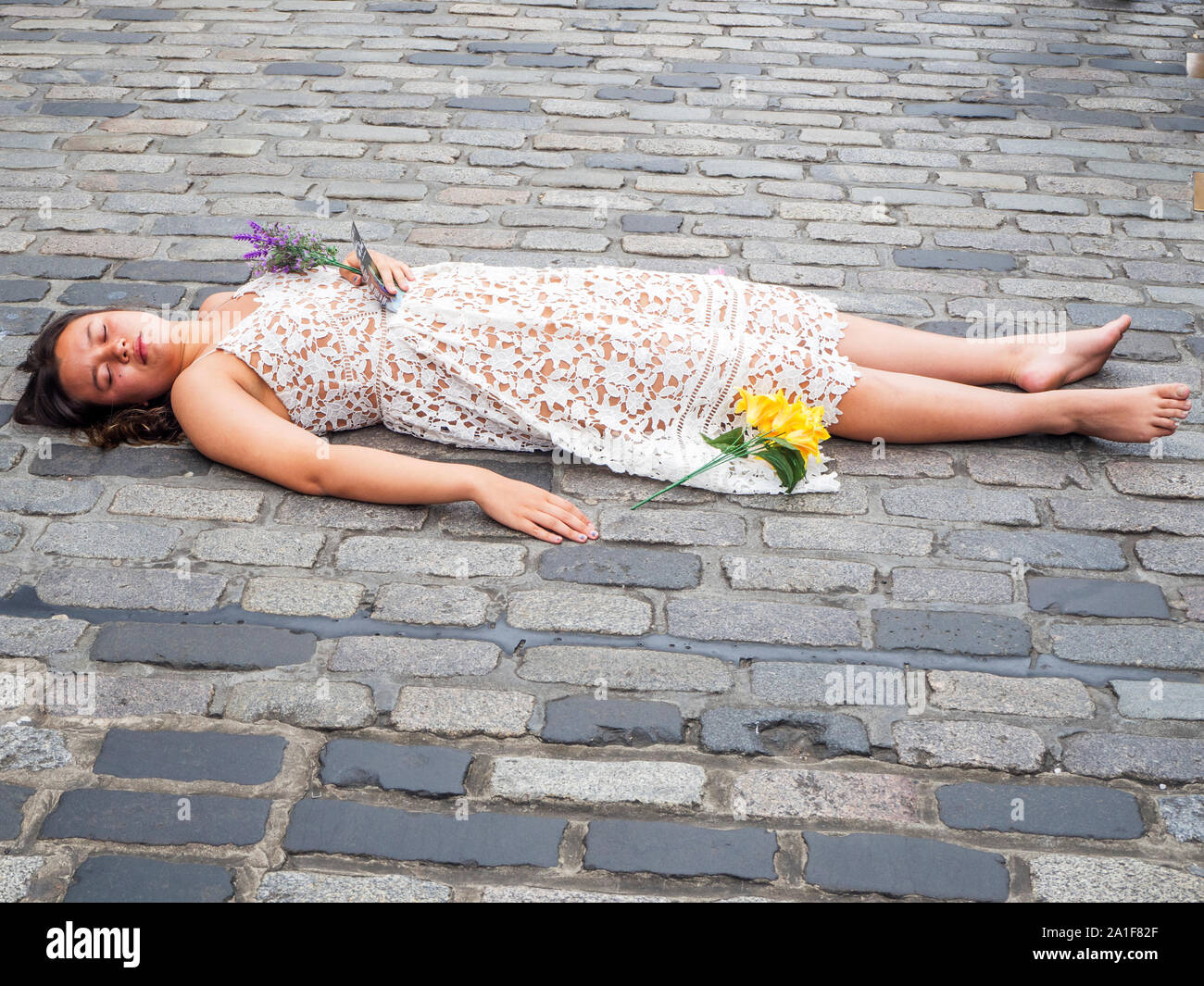 Actor lying on the cobbles on The Royal Mile to promote the Durham ...
