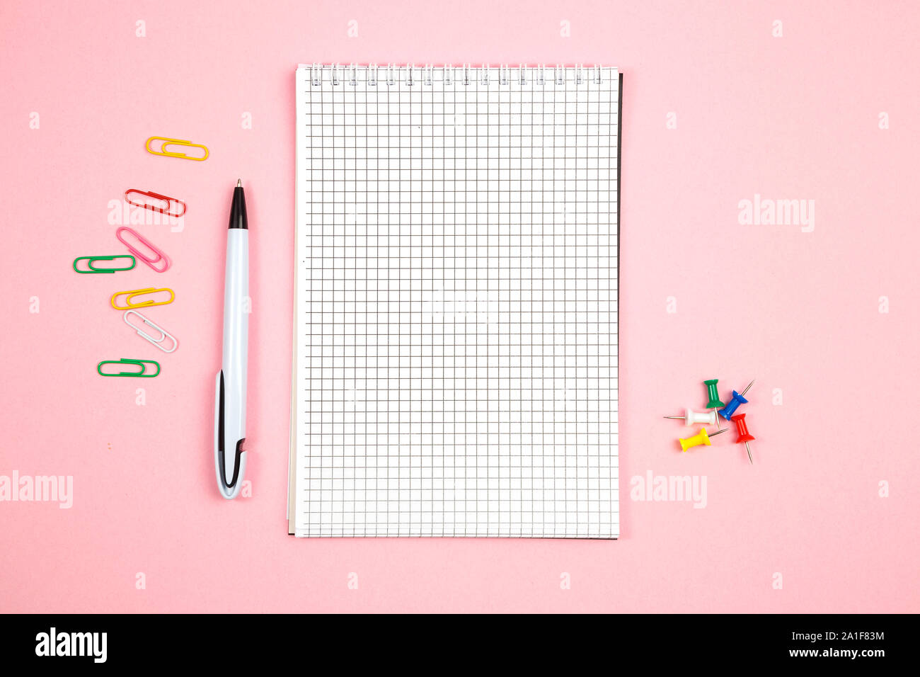 paper notebook with pen on pink isolated background. top view. flat lay ...