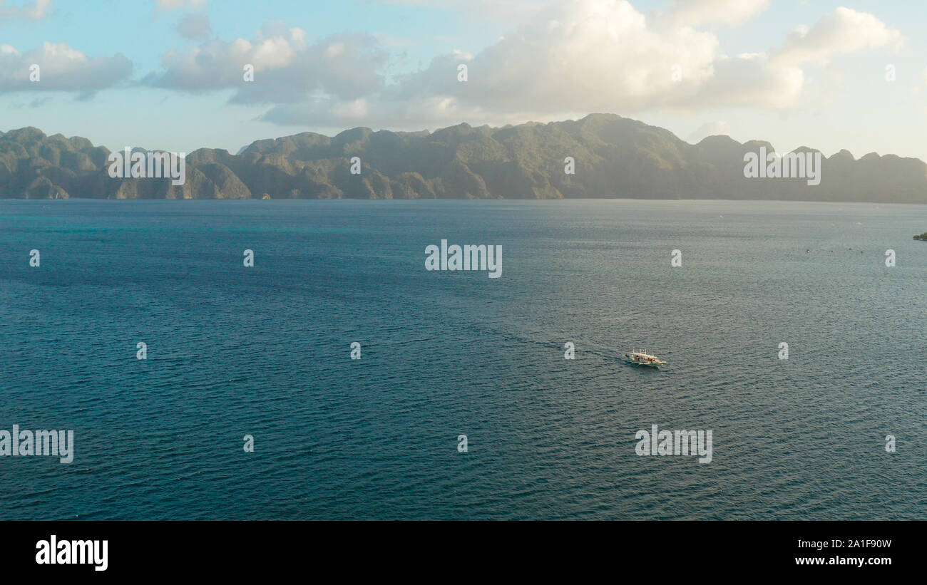 Aerial view seascape bay with islands and mountains sunset. tour boat ...