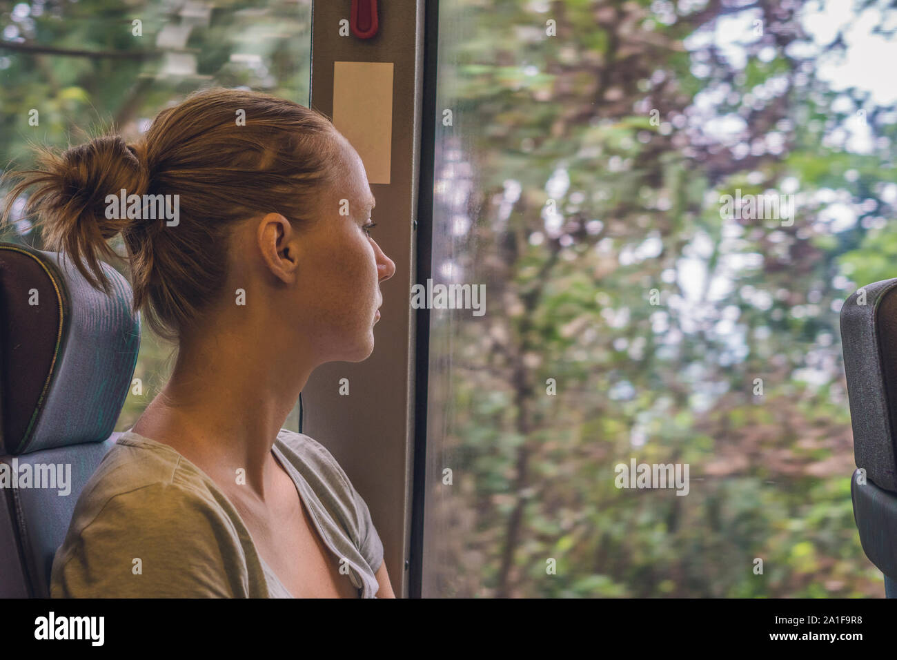 beautiful young woman taking bus to work Stock Photo - Alamy