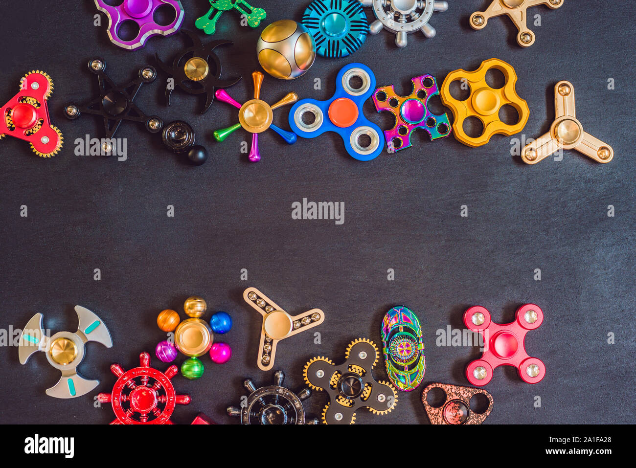 A lot of different spinners on a black background Stock Photo - Alamy