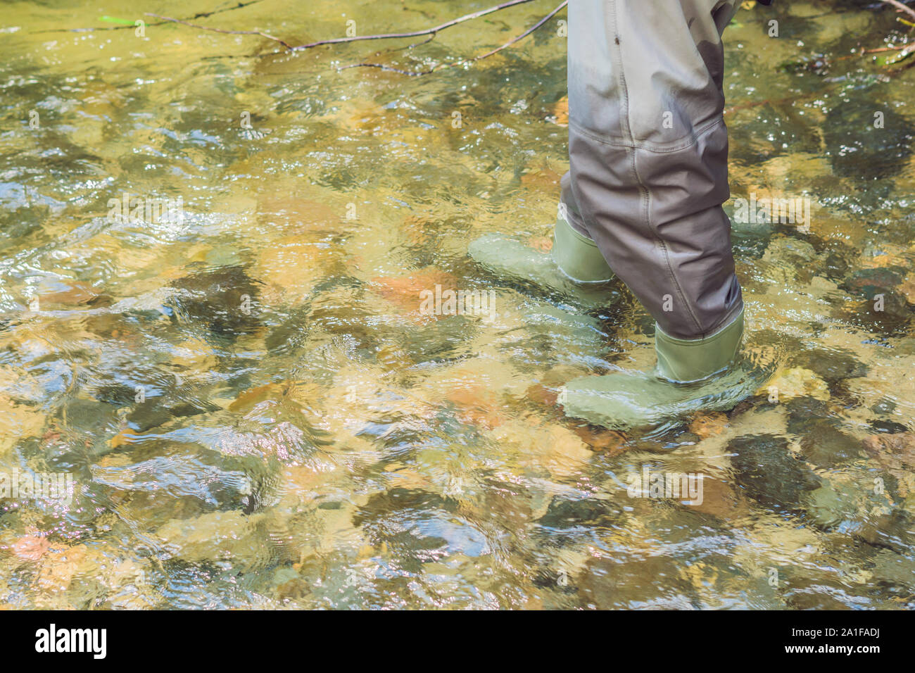Man s foot in rubber boots. Rubber boots of the fisherman Stock Photo ...