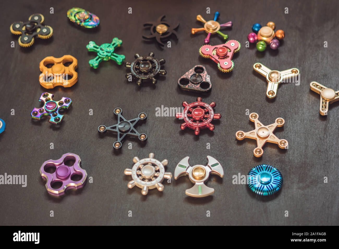 A lot of different spinners on a black background Stock Photo - Alamy