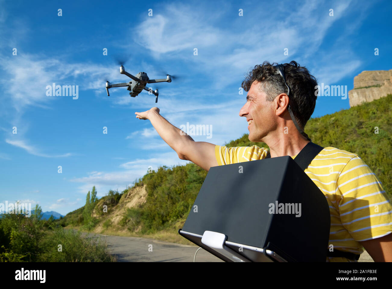 Helicopter drone controlled by a man hi-res stock photography and ...