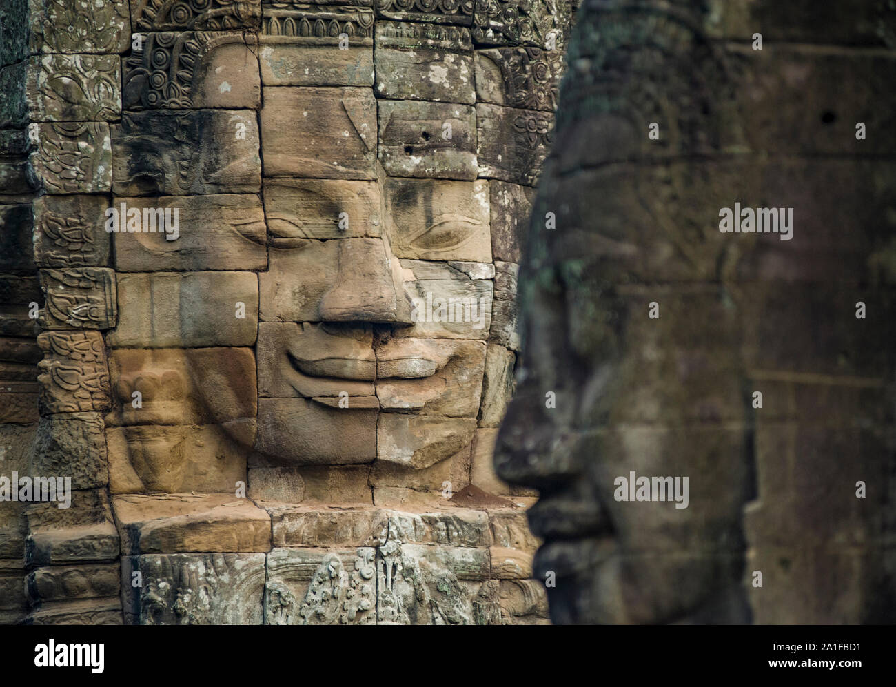 Carved face at Angkor Wat, major historical landmark of Cambodia Stock ...