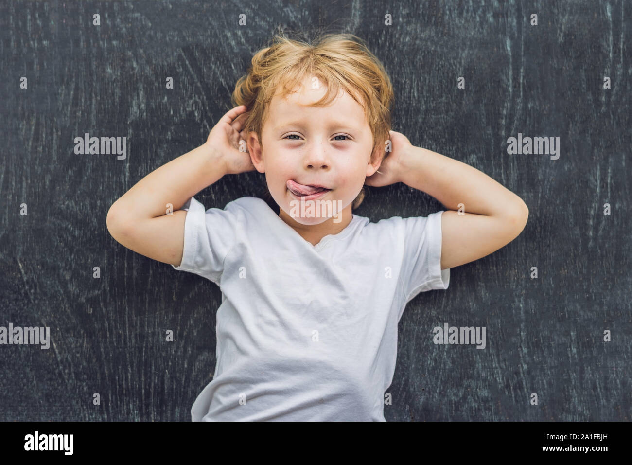 Top view of a little blond kid boy with space for text and symbols on ...