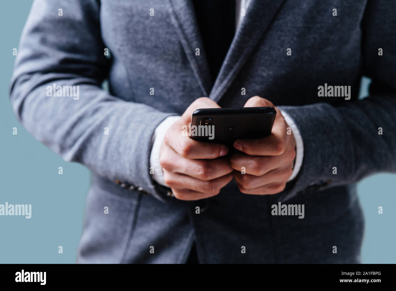 Businessman typing sms on cell hi-res stock photography and images - Alamy
