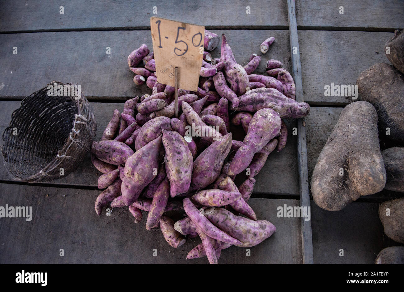Purple Yam priced on wooden surface in a street market of Belem Stock ...