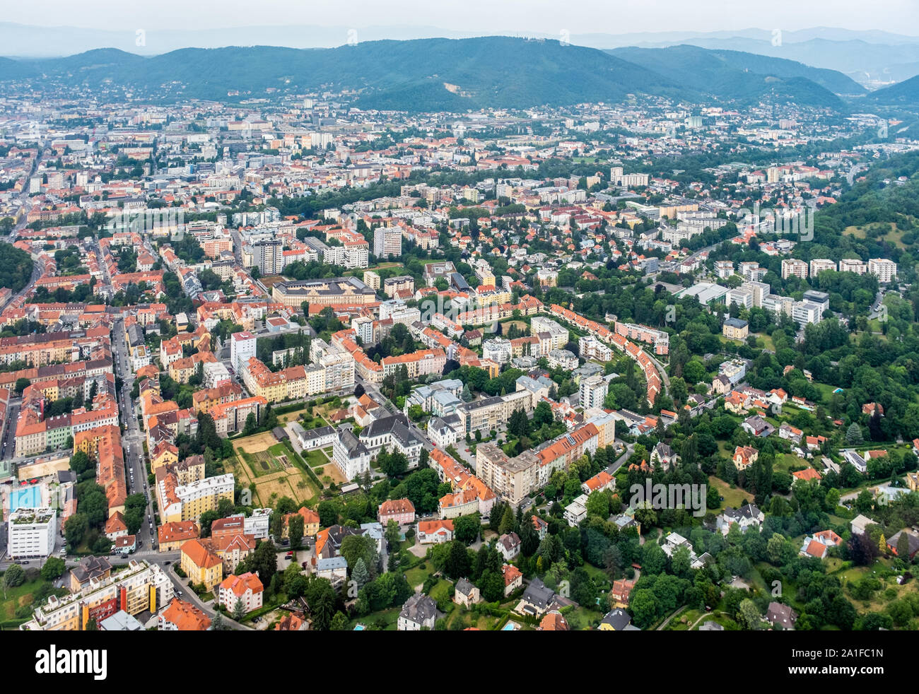 Aerial view of city Graz from helicopter drone with district Geidorf on ...