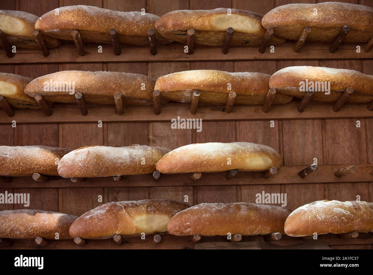 Fresh artisan bread in row at Brazilian bakery shelf Stock Photo - Alamy