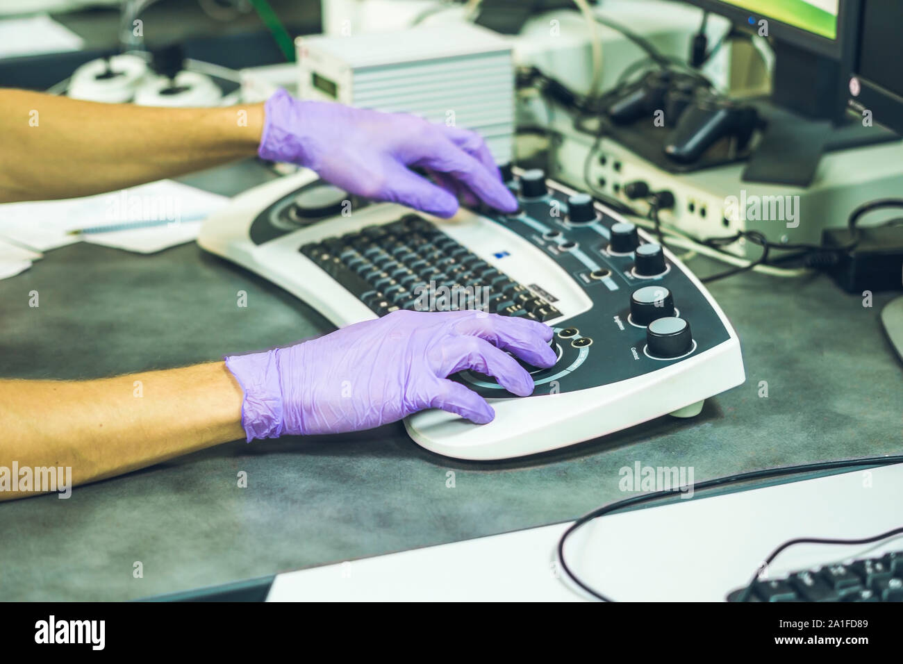 Hands of a scientist on a ontrol panel of an electron microscope Stock ...