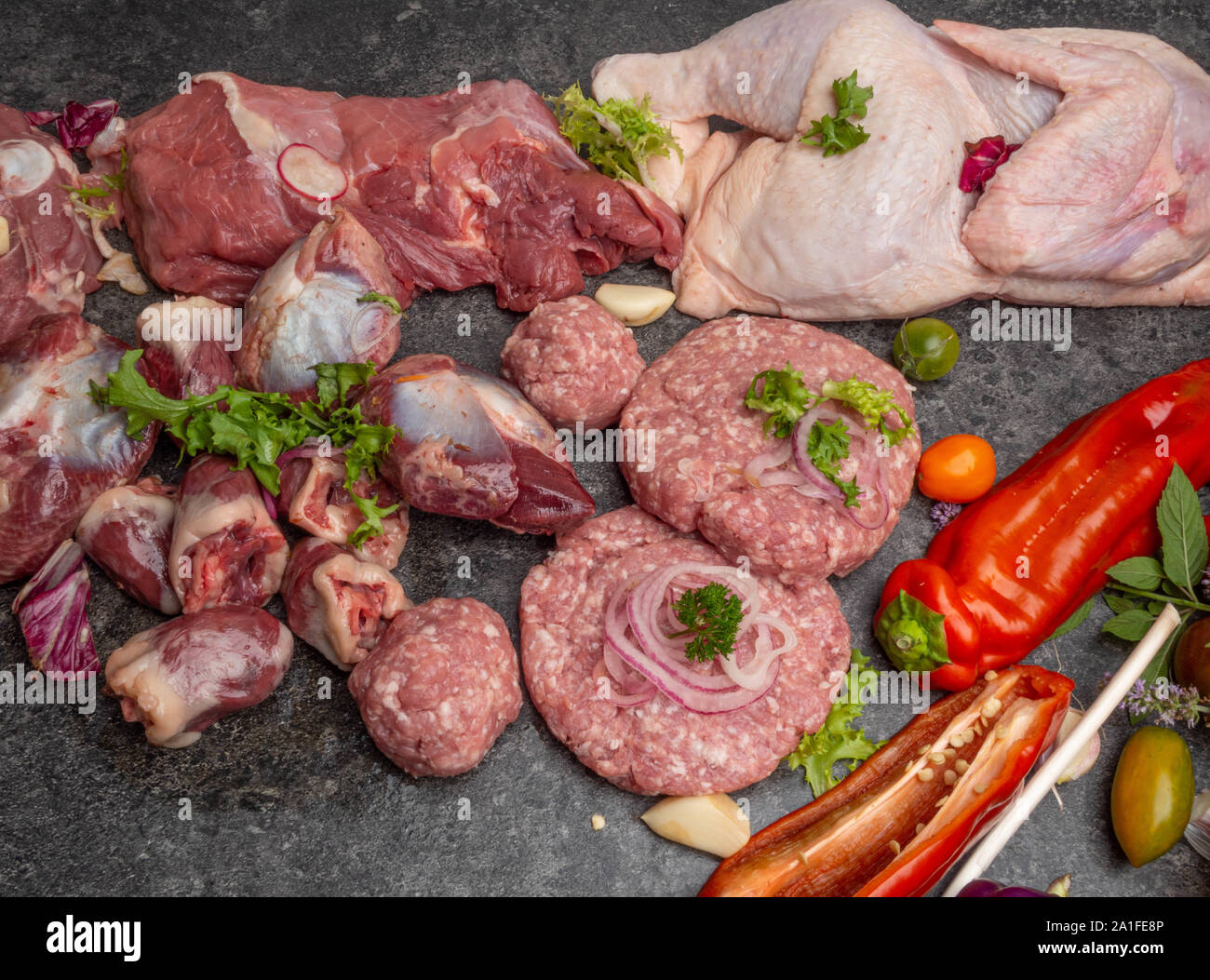 Different types of raw meat: beef, chicken, lamb, gilbert, pork, herbs ...