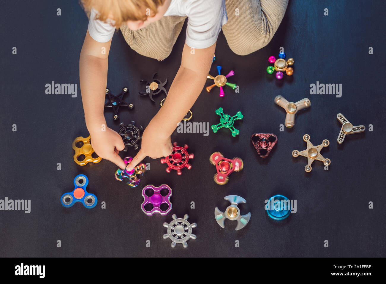 A lot of different spinners on a black background Stock Photo - Alamy