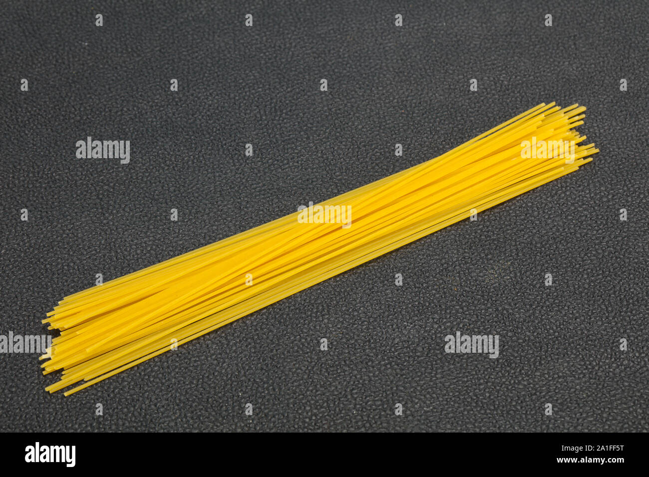 Dry raw spaghetti ready for bowling Stock Photo - Alamy