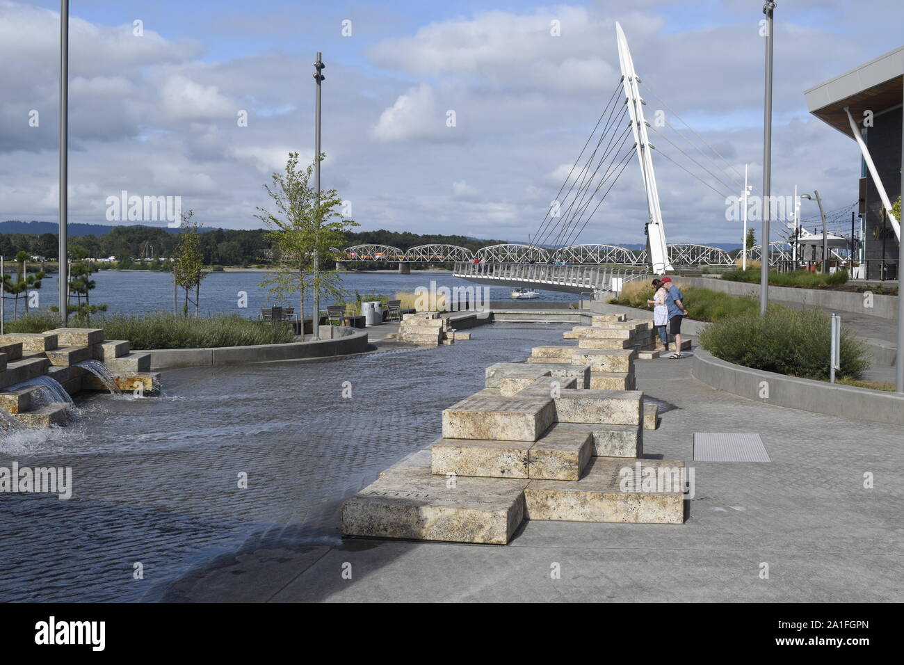 Water flows out cracks in the stone blocks and down a main channel of ...