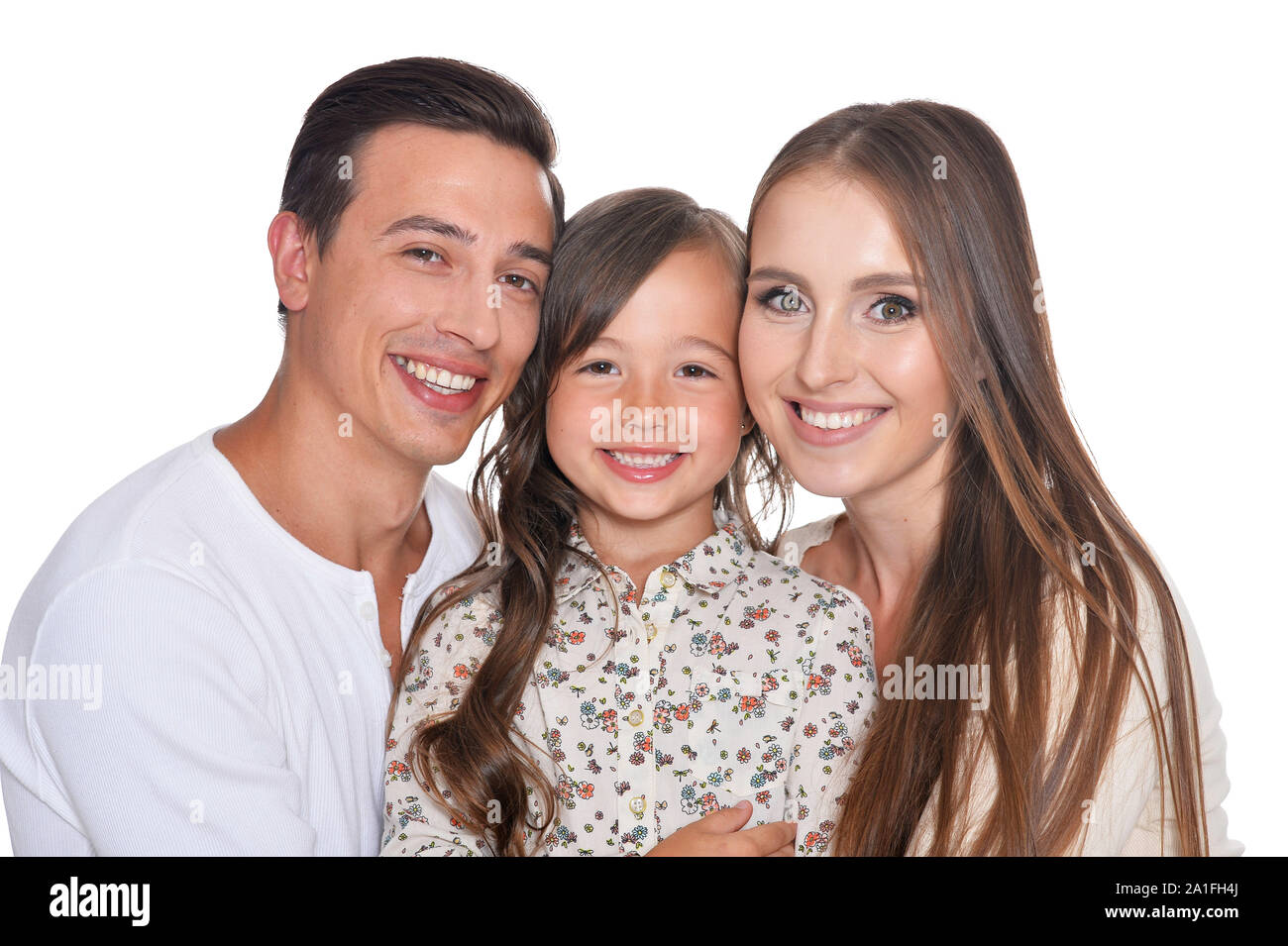 Happy beautiful family of three posing on white background Stock Photo ...