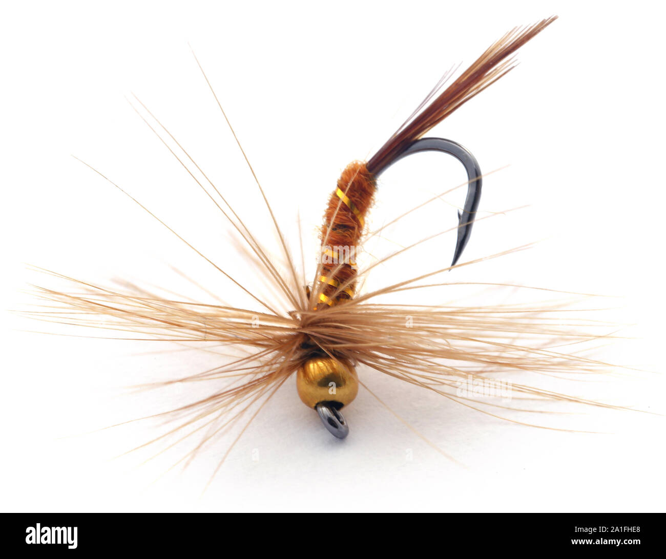 Fishing fly with hook over white background Stock Photo - Alamy