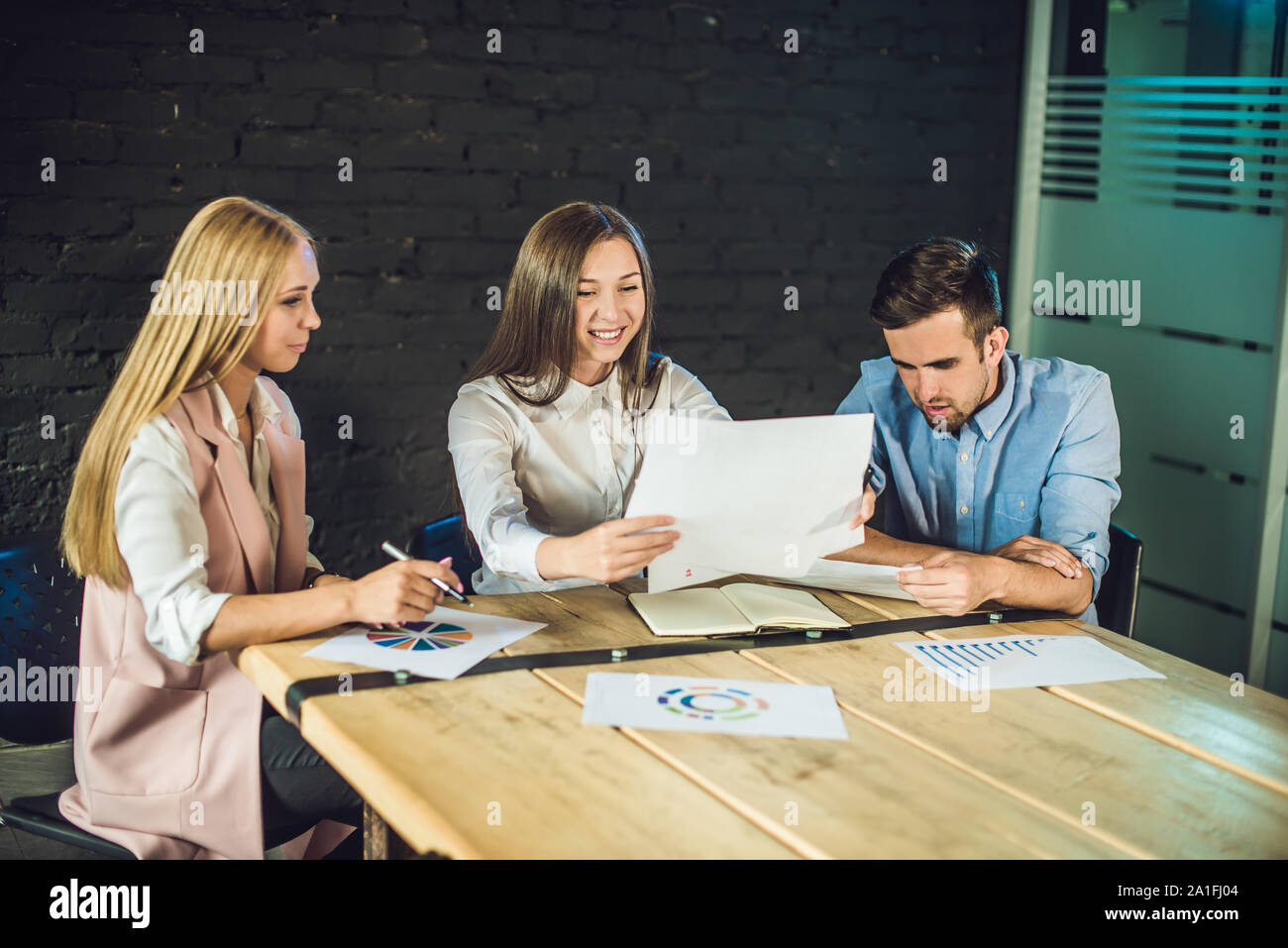 Young team of coworkers watching storyboard for shooting video in ...