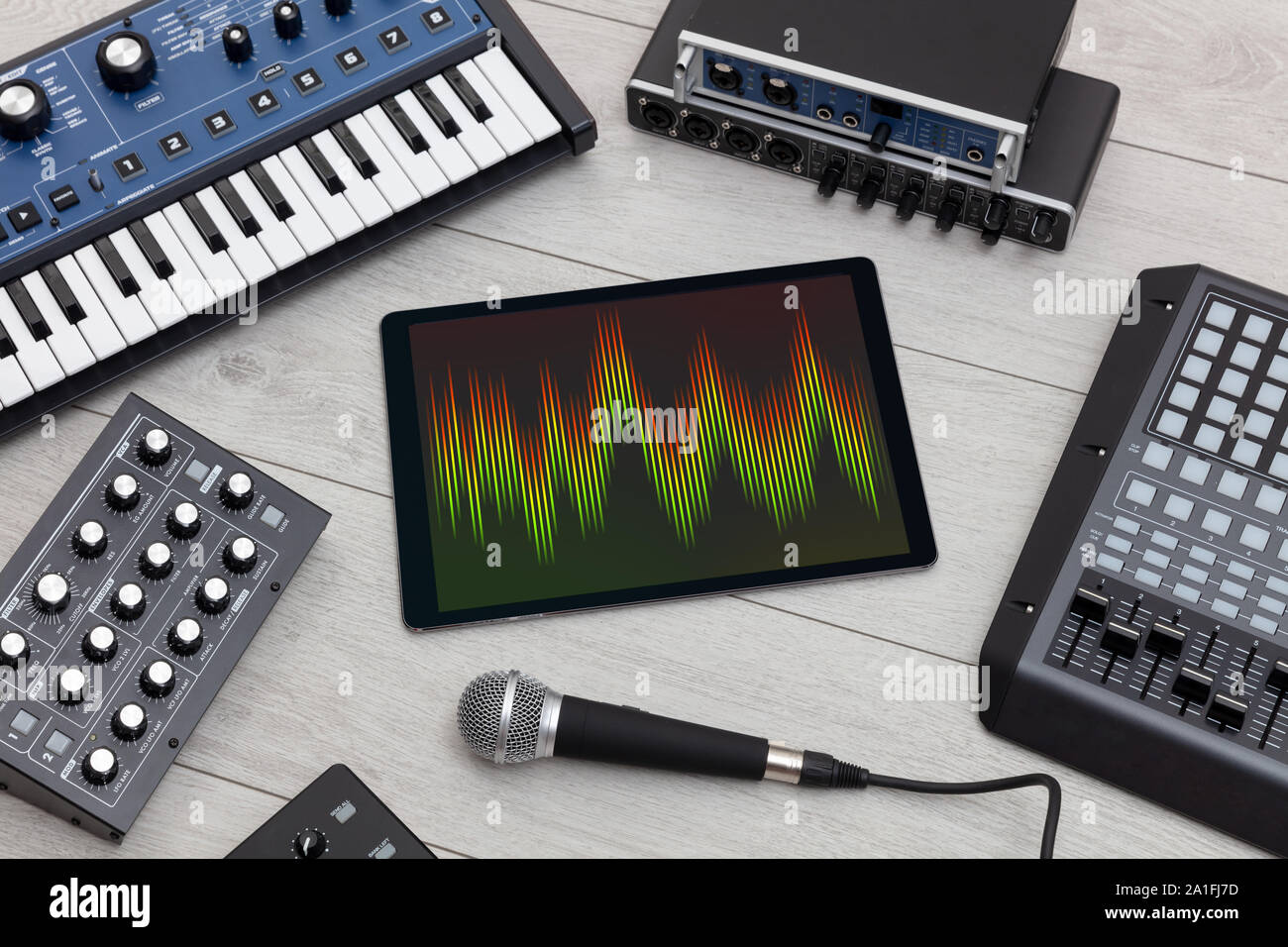 Recording music with tablet and electronic music instruments Stock ...