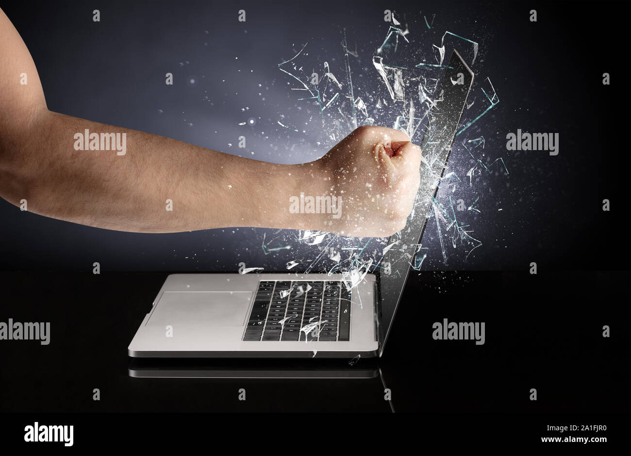 Hand hitting strongly laptop screen glass Stock Photo - Alamy