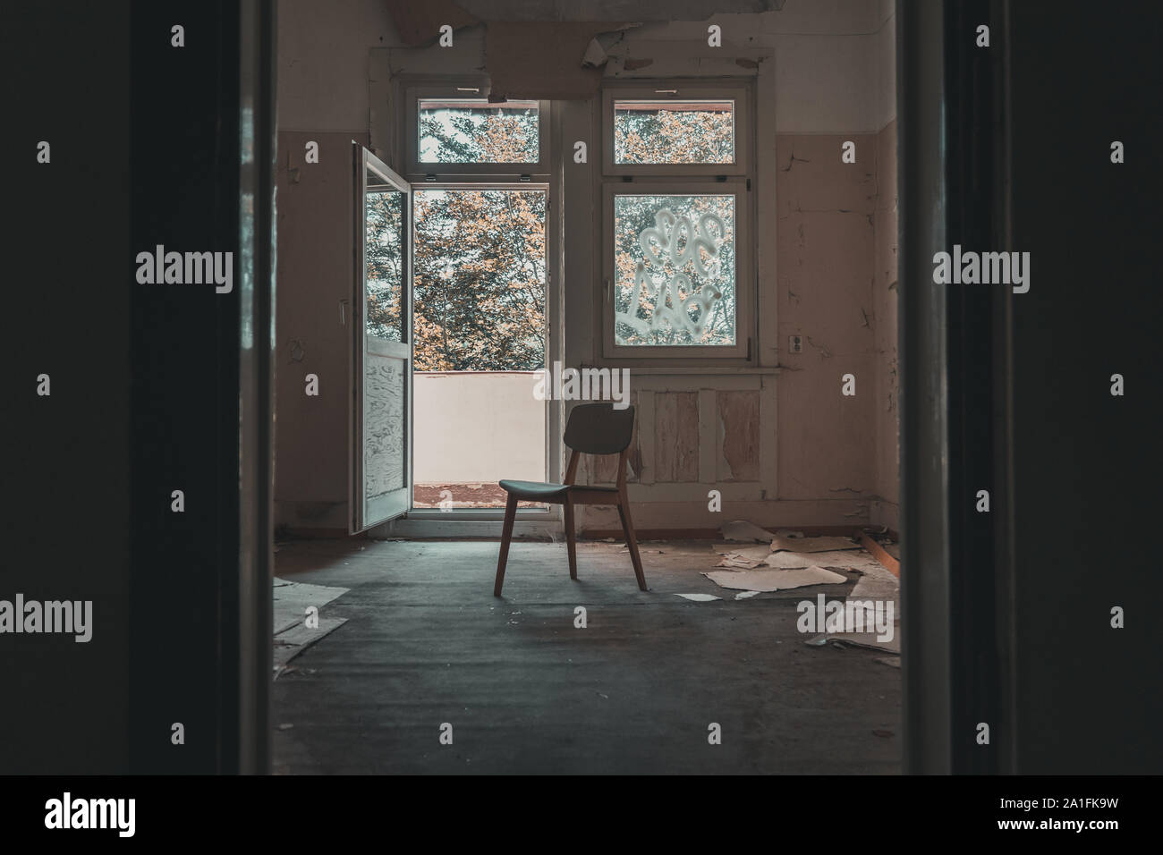 chair in a room in an abandoned building Stock Photo - Alamy