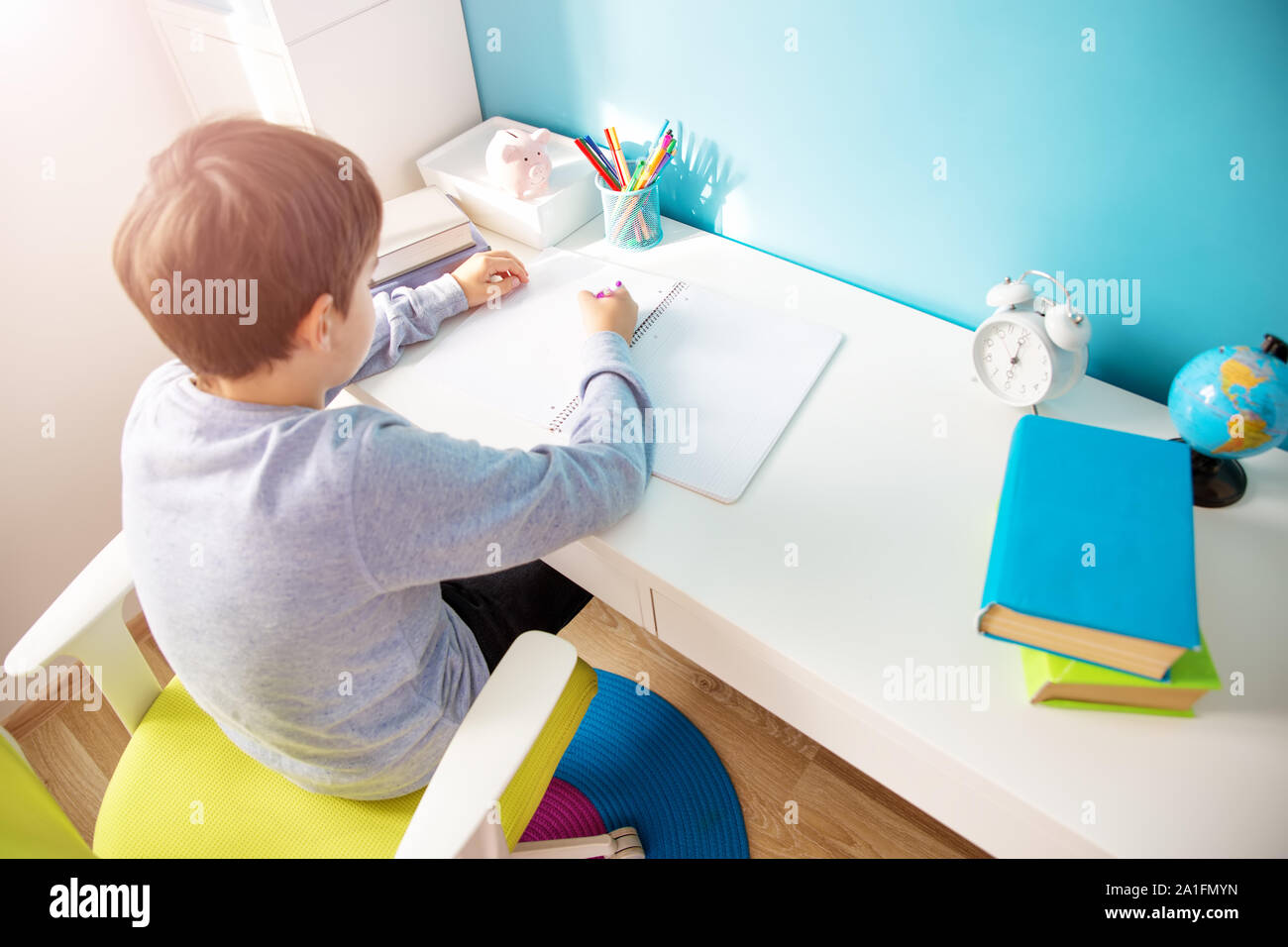 Child writing hi-res stock photography and images - Alamy