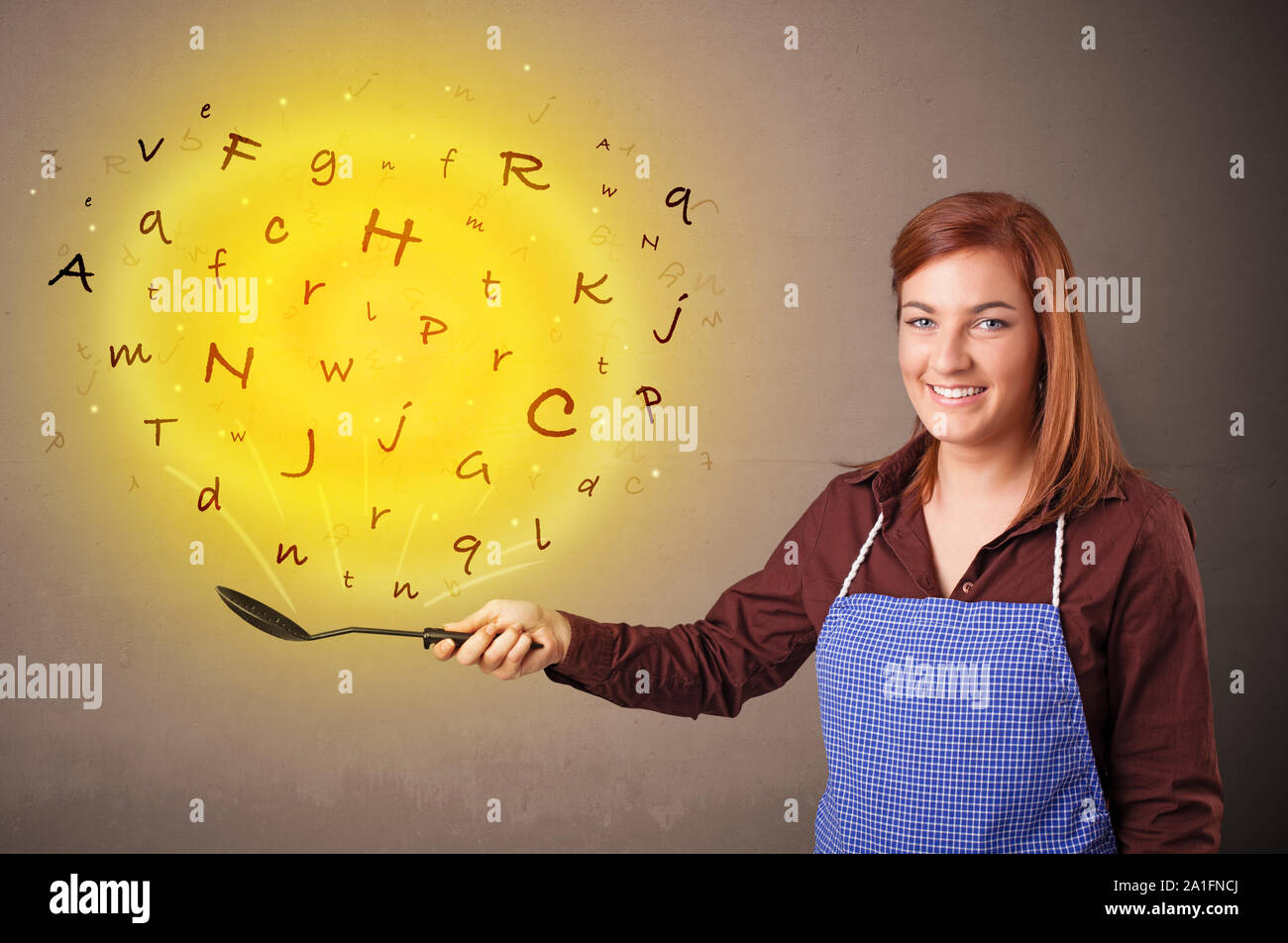 Young person cooking letters in wok Stock Photo - Alamy