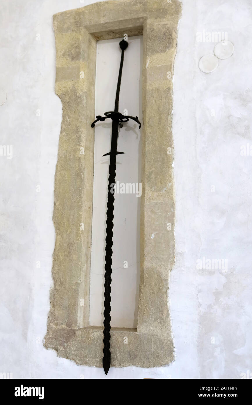 Ancient sword mounted on the wall Stock Photo - Alamy
