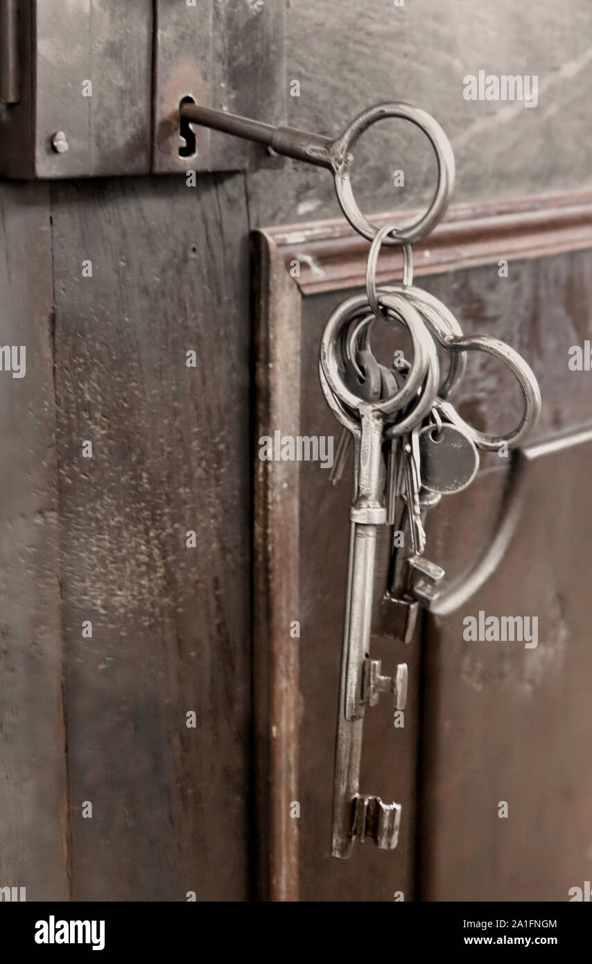 Medieval antique keys in a old door lock Stock Photo - Alamy