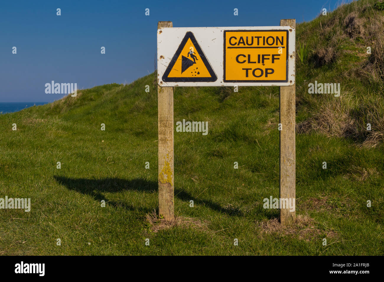 Cliff top warning sign at Peveril Point, Swanage, Dorset, UK Stock ...