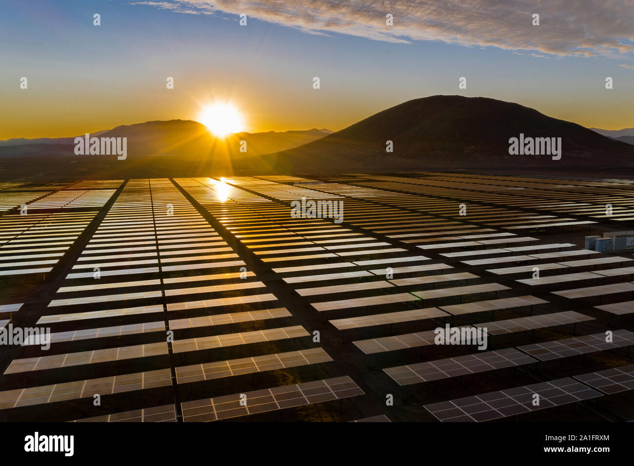 Aerial view of hundreds solar energy panels rows along the dry lands at Atacama Desert, Chile ...