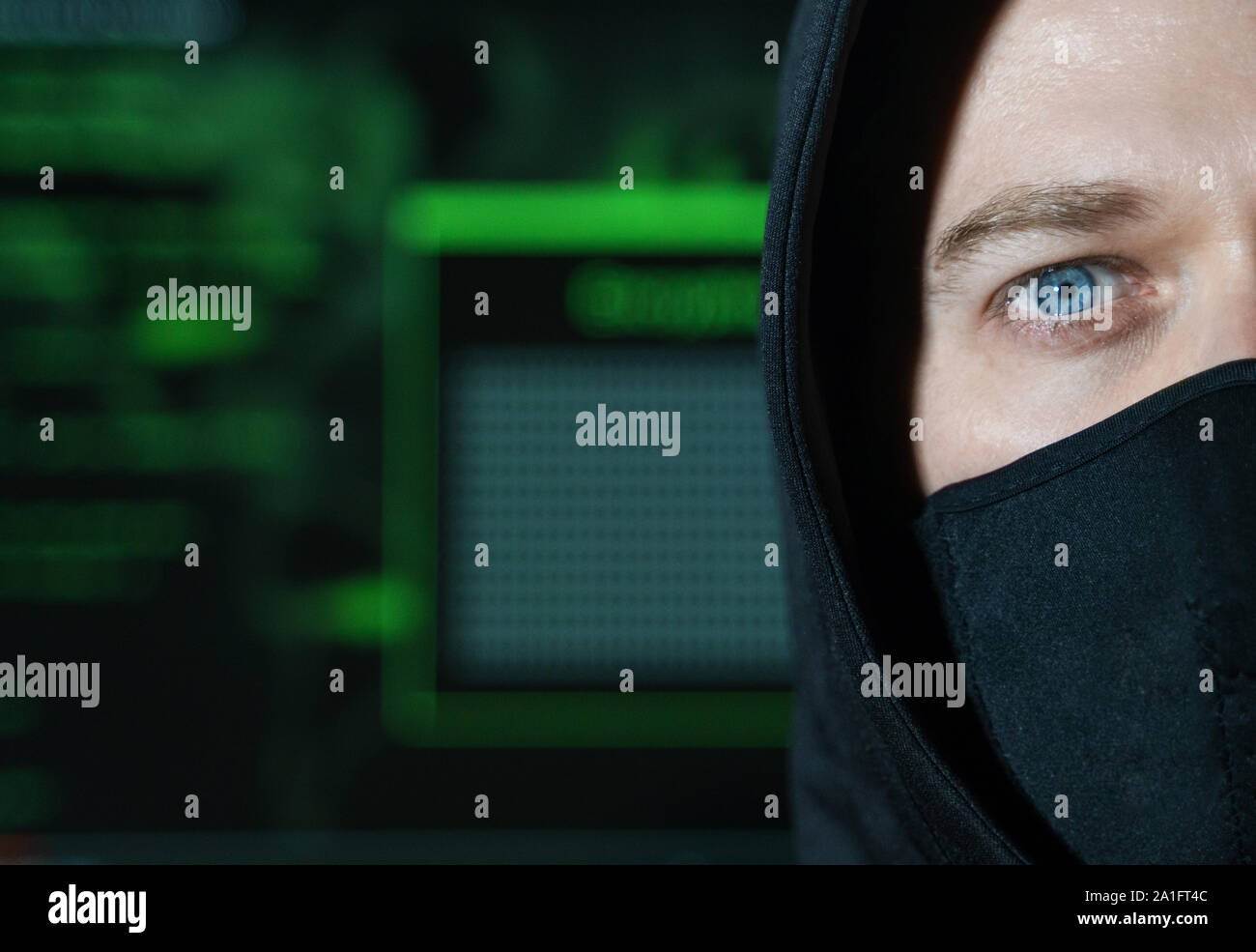 Hacker in black mask. Hacking and internet security concept Stock Photo ...