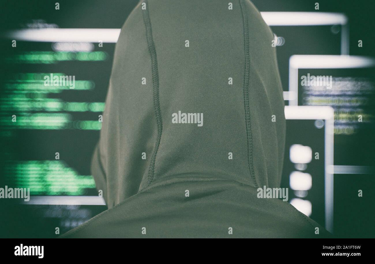 Anonymous hacker in black hoodie hi-res stock photography and images - Alamy