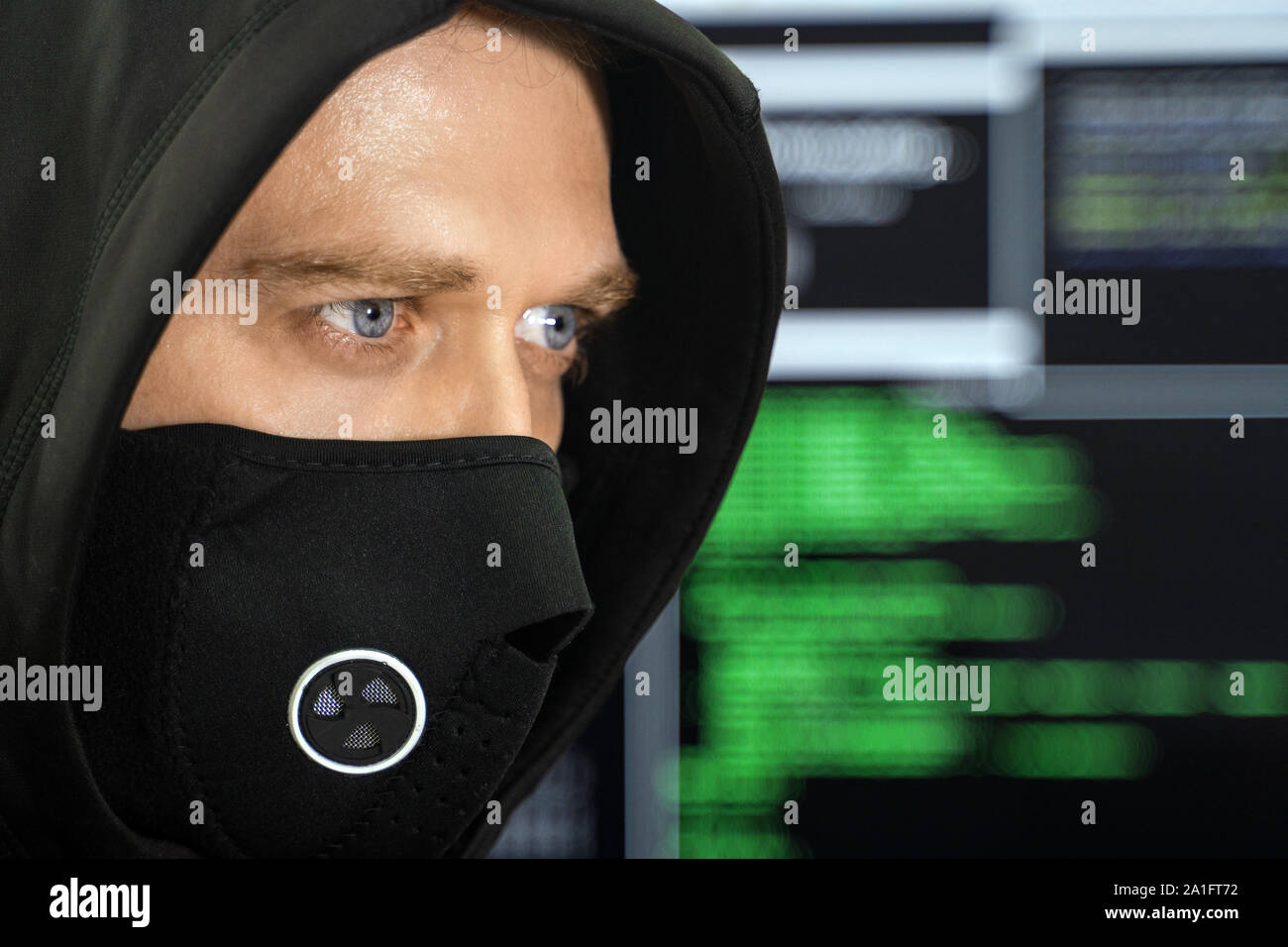 Hacker in black mask. Hacking and internet security concept Stock Photo ...