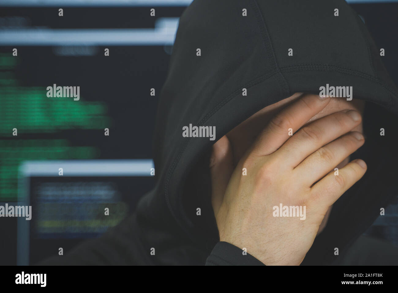 Hacker hiding his face. Hacking and internet security concept Stock ...