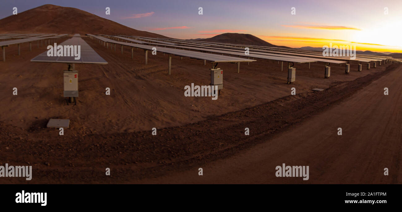 Hundreds solar energy panels rows along the dry lands at Atacama Desert ...