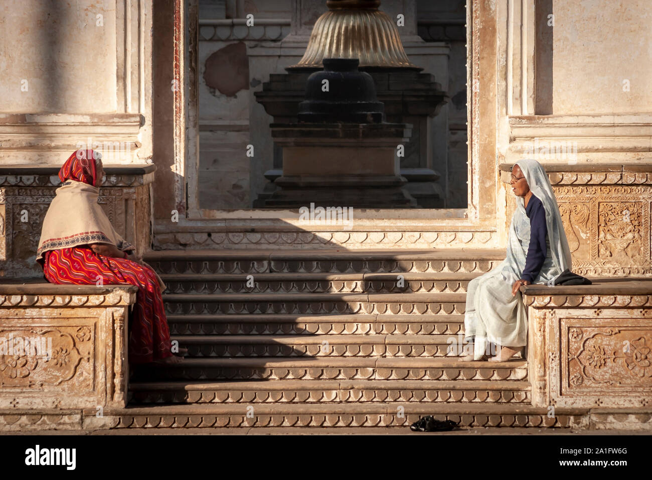 old ladies chatting in india outside temple Stock Photo - Alamy