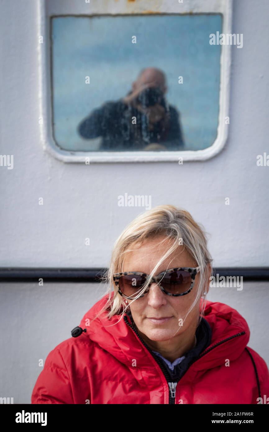 man caught taking photo of glamorous lady Stock Photo - Alamy